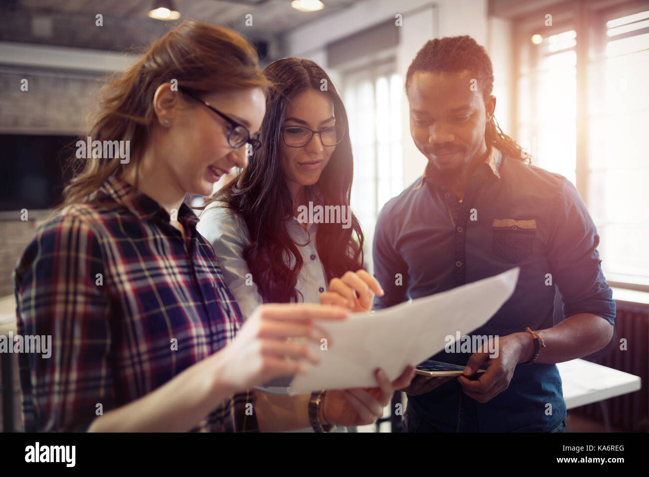 Company employees working in office Stock Photo - Alamy