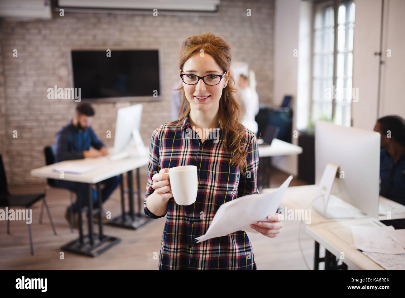 Beautiful woman working in modern office Stock Photo - Alamy