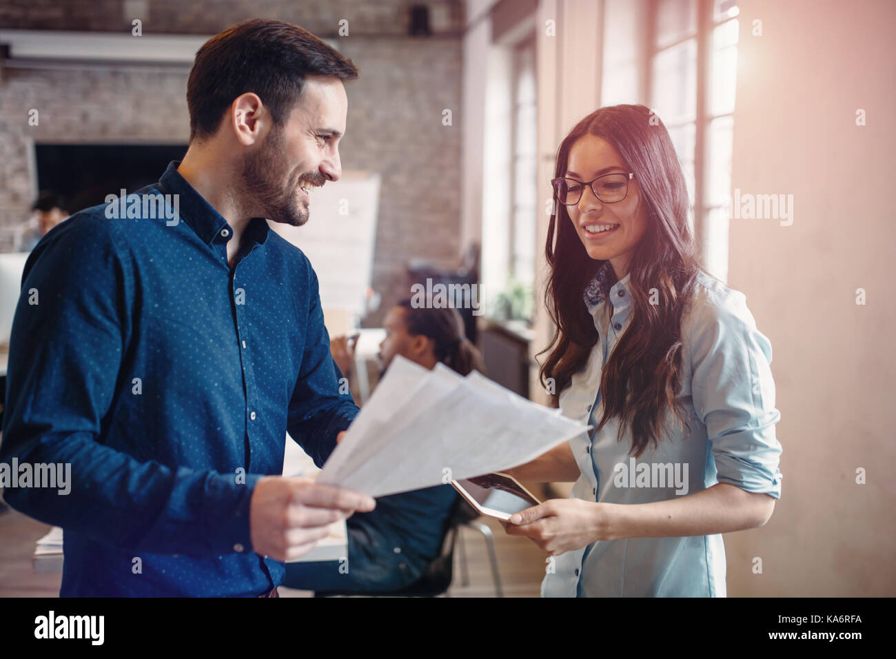 Company coworkers working in office Stock Photo - Alamy