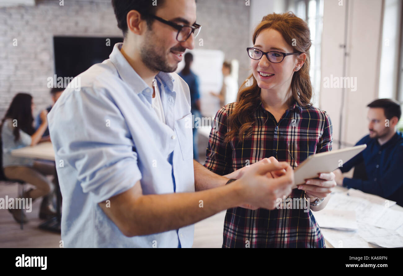 Company coworkers working in office Stock Photo - Alamy