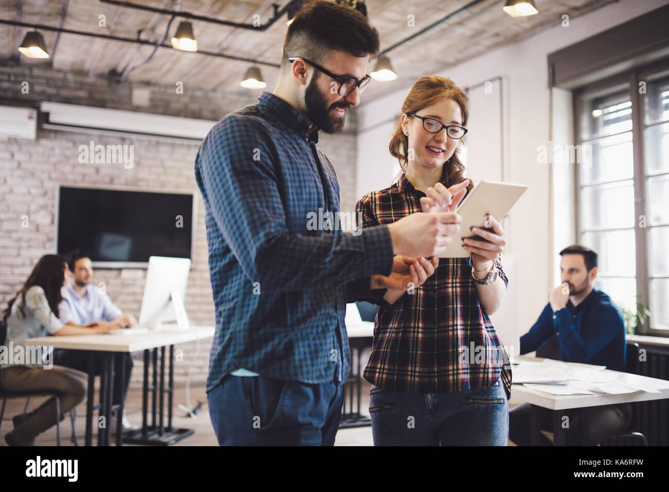 Company coworkers working in office Stock Photo - Alamy