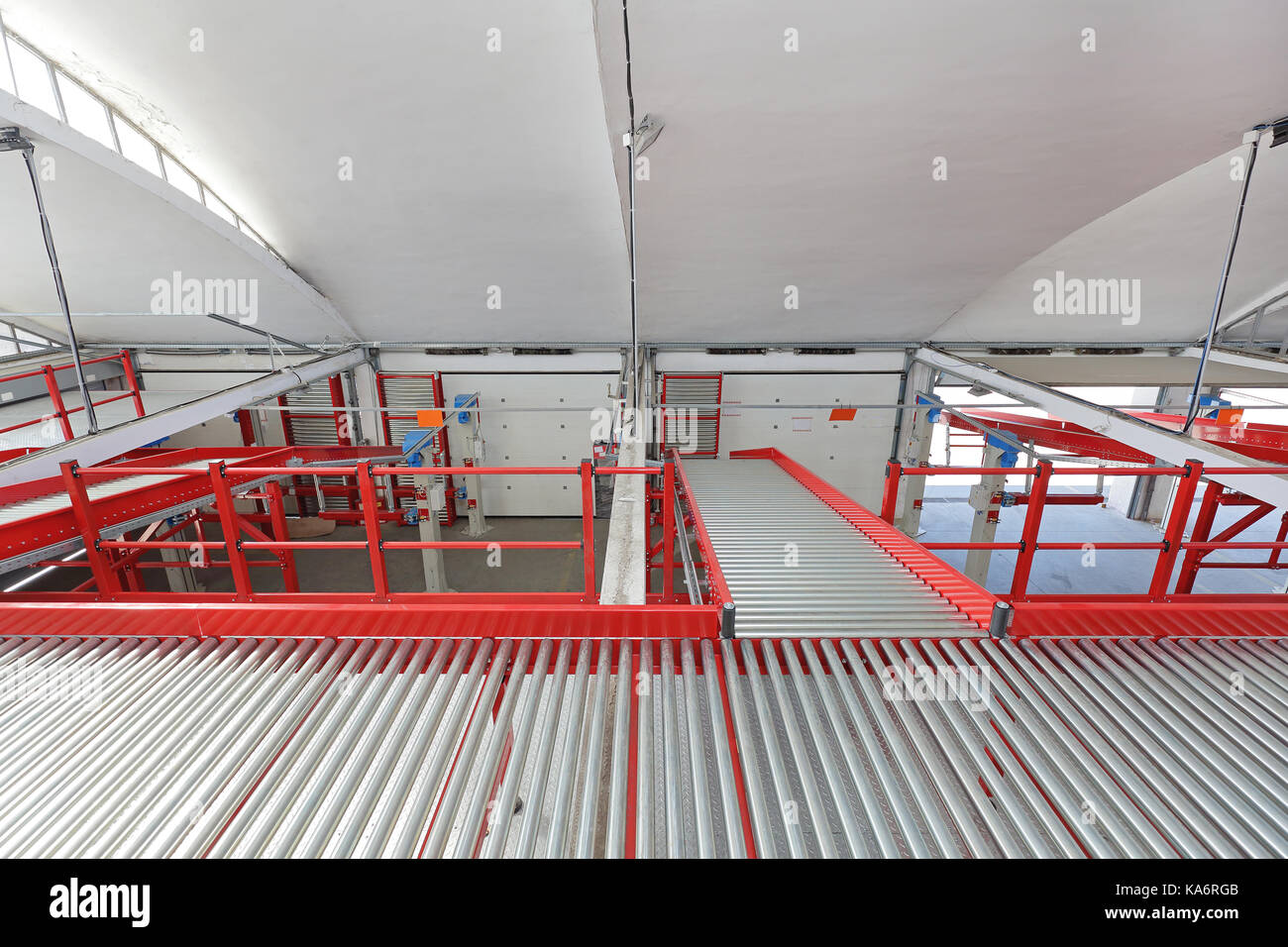 Conveyor Rollers in Shipping and Distribution Warehouse Stock Photo - Alamy