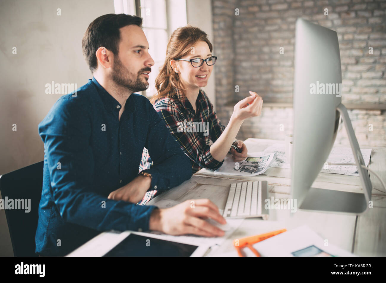 Company employees working in office Stock Photo - Alamy