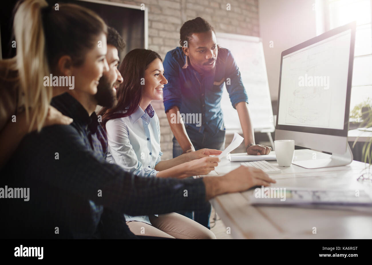 Group young employees working hi-res stock photography and images - Alamy