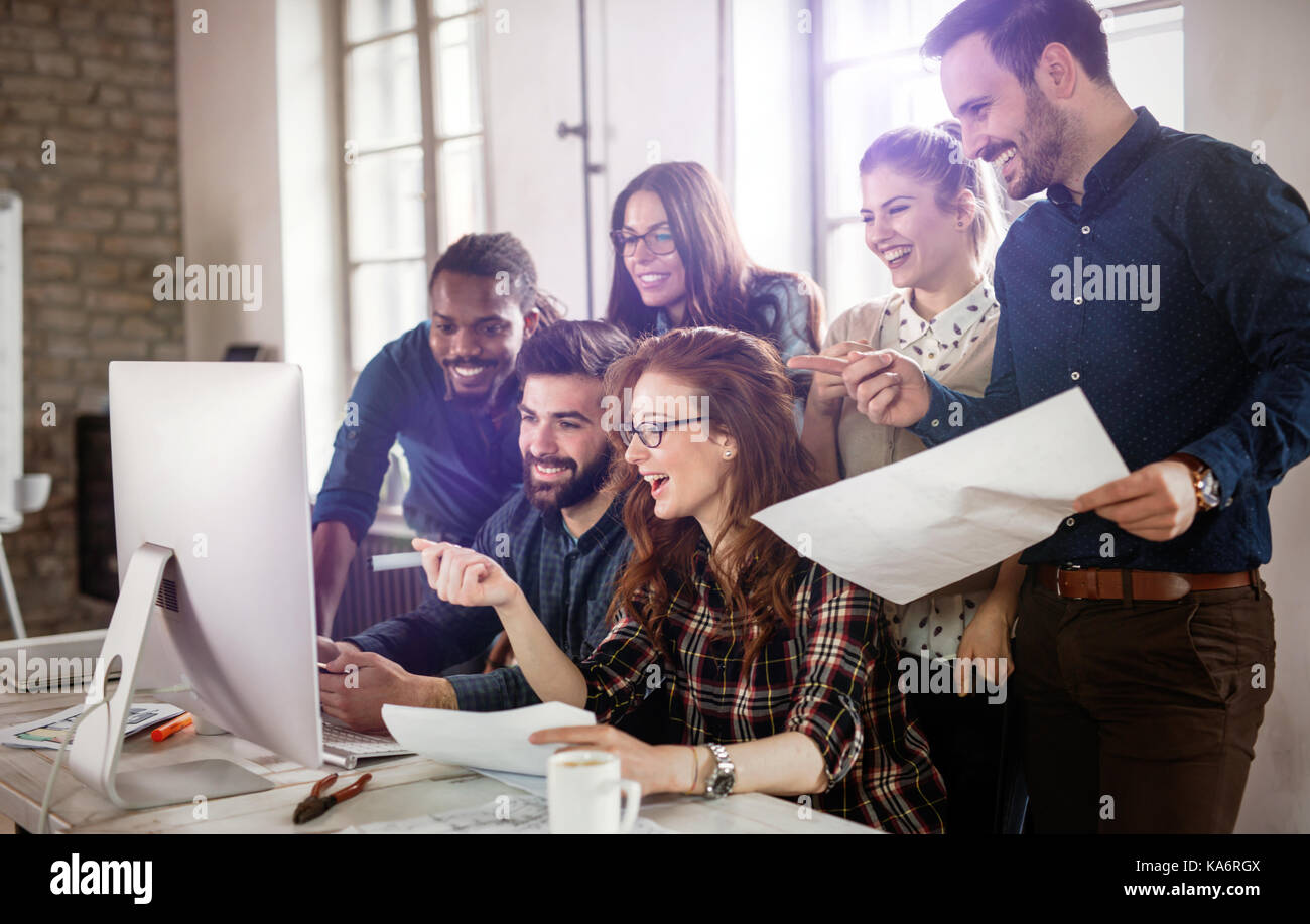 Company employees working in office Stock Photo - Alamy