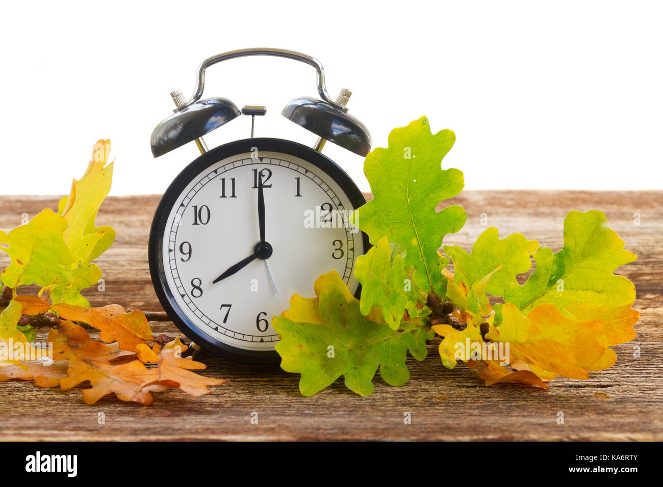 Autumn time - fall leaves with clock Stock Photo - Alamy