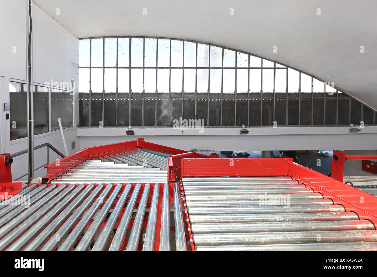 Conveyor Rollers in Shipping and Distribution Warehouse Stock Photo - Alamy