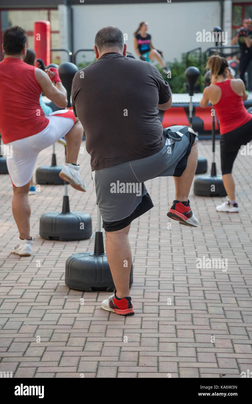Fat Man in Fitness Class: Workout with Free Standing Boxing Punch Bag ...