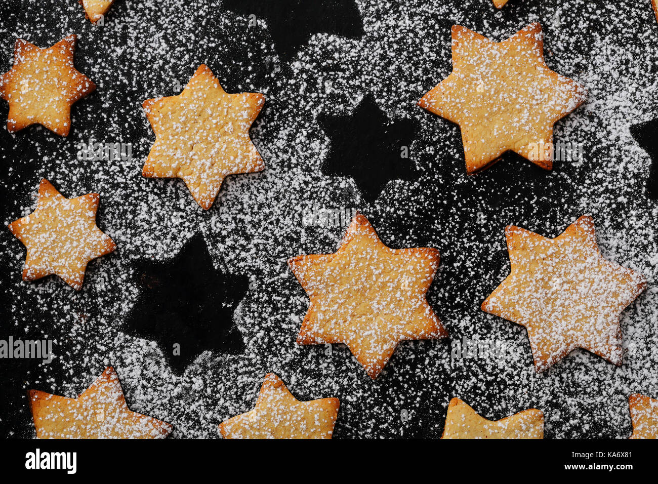 Stars cookies on black, christmas background Stock Photo - Alamy
