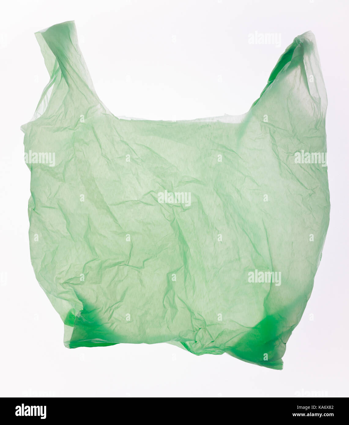 Green plastic bag isolated on white Stock Photo - Alamy