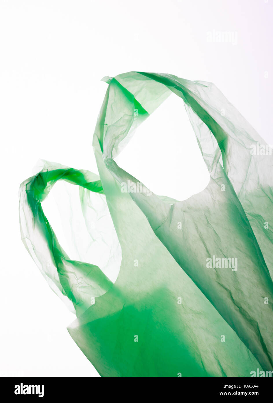 Green plastic bag isolated on white Stock Photo - Alamy