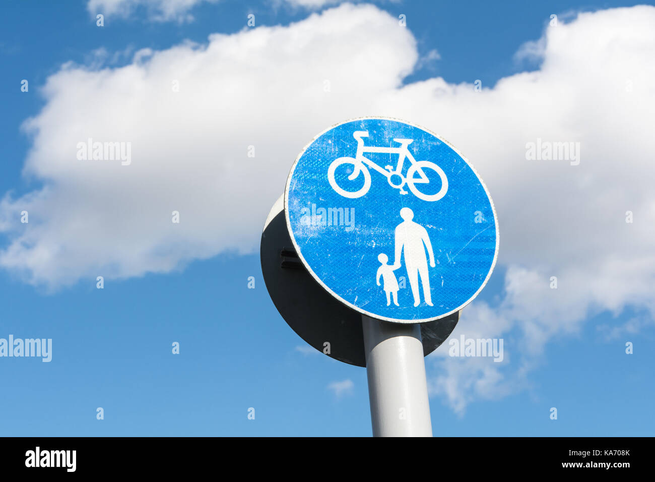A British blue and white road sign indicating a shared use for ...