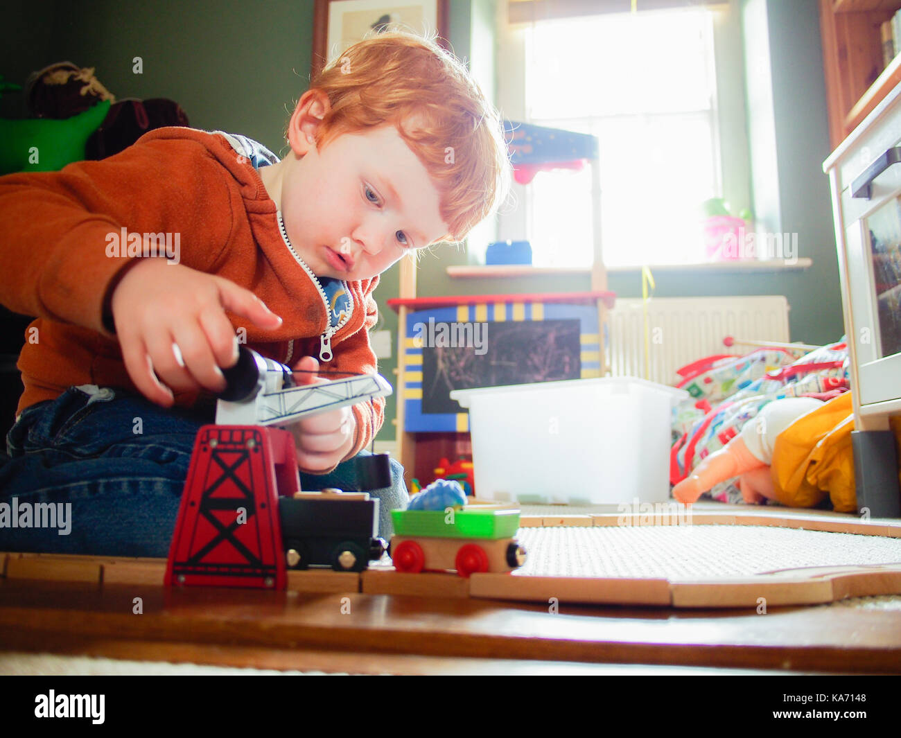 Hamish playing with his train track Stock Photo - Alamy