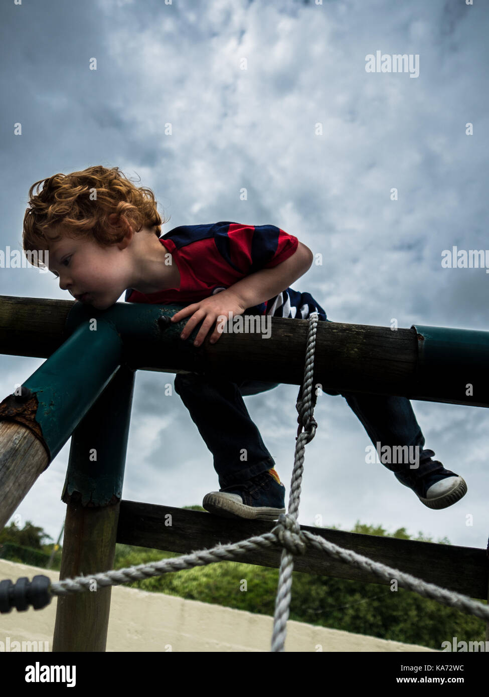 Kids climbing up rope hi-res stock photography and images - Alamy