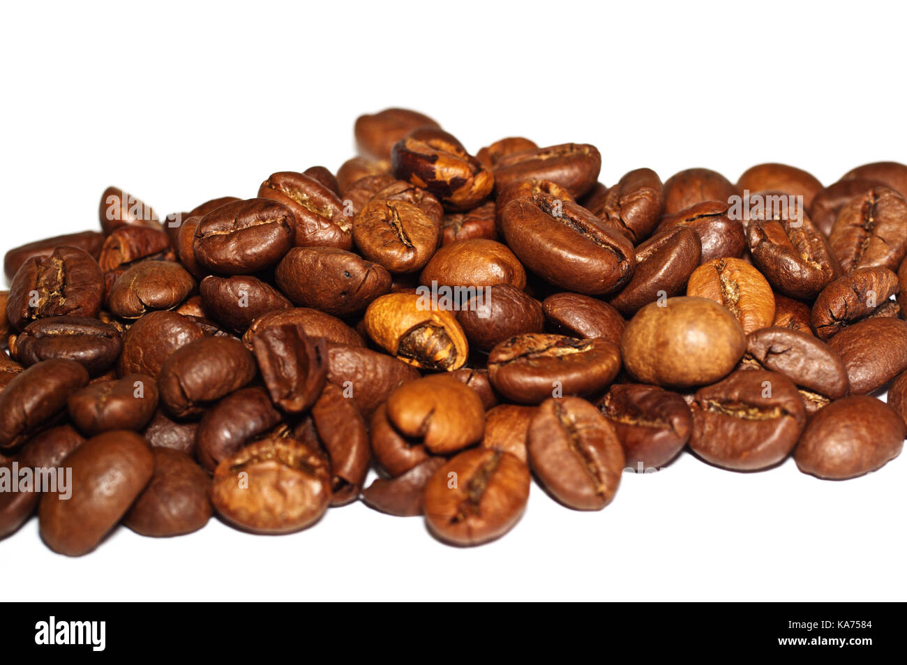 Coffee Grains fried on a white background. Macro Stock Photo - Alamy
