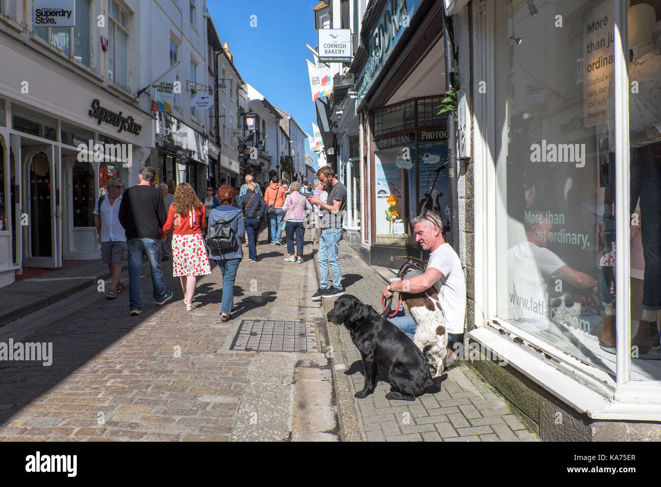 St Ives - holidaymakers and visitors walking through Fore Street in St ...