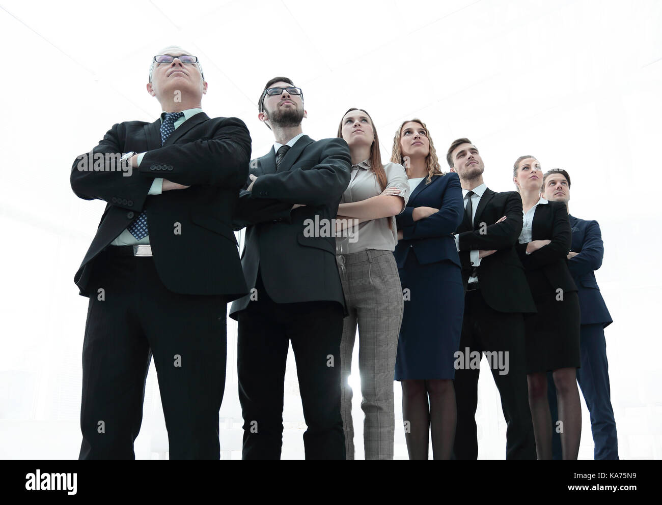 bottom view. successful business team standing together Stock Photo - Alamy