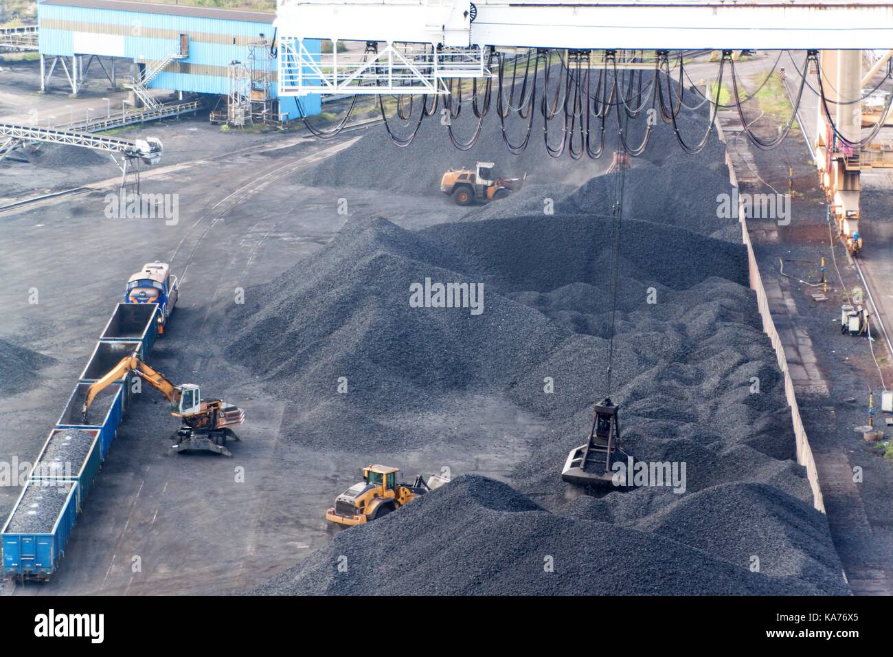 Work in port coal transshipment terminal. Coal unloading of wagons with ...
