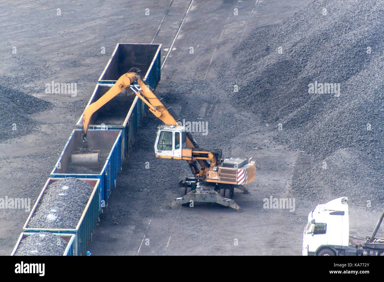 Work in port coal transshipment terminal. Coal unloading of wagons with ...