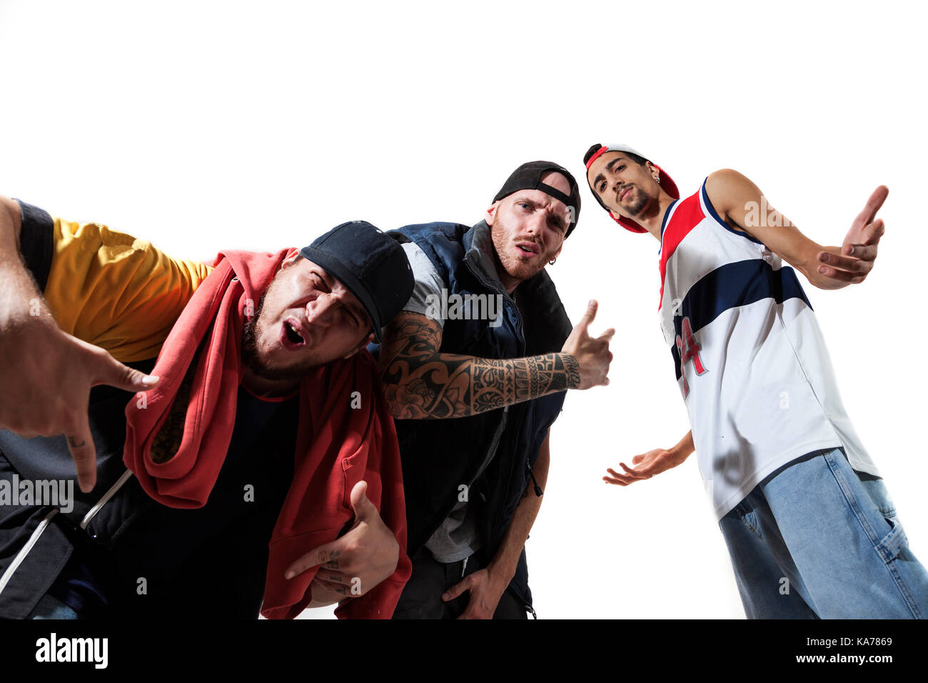 group of three rappers posing in the photographic studio on white ...