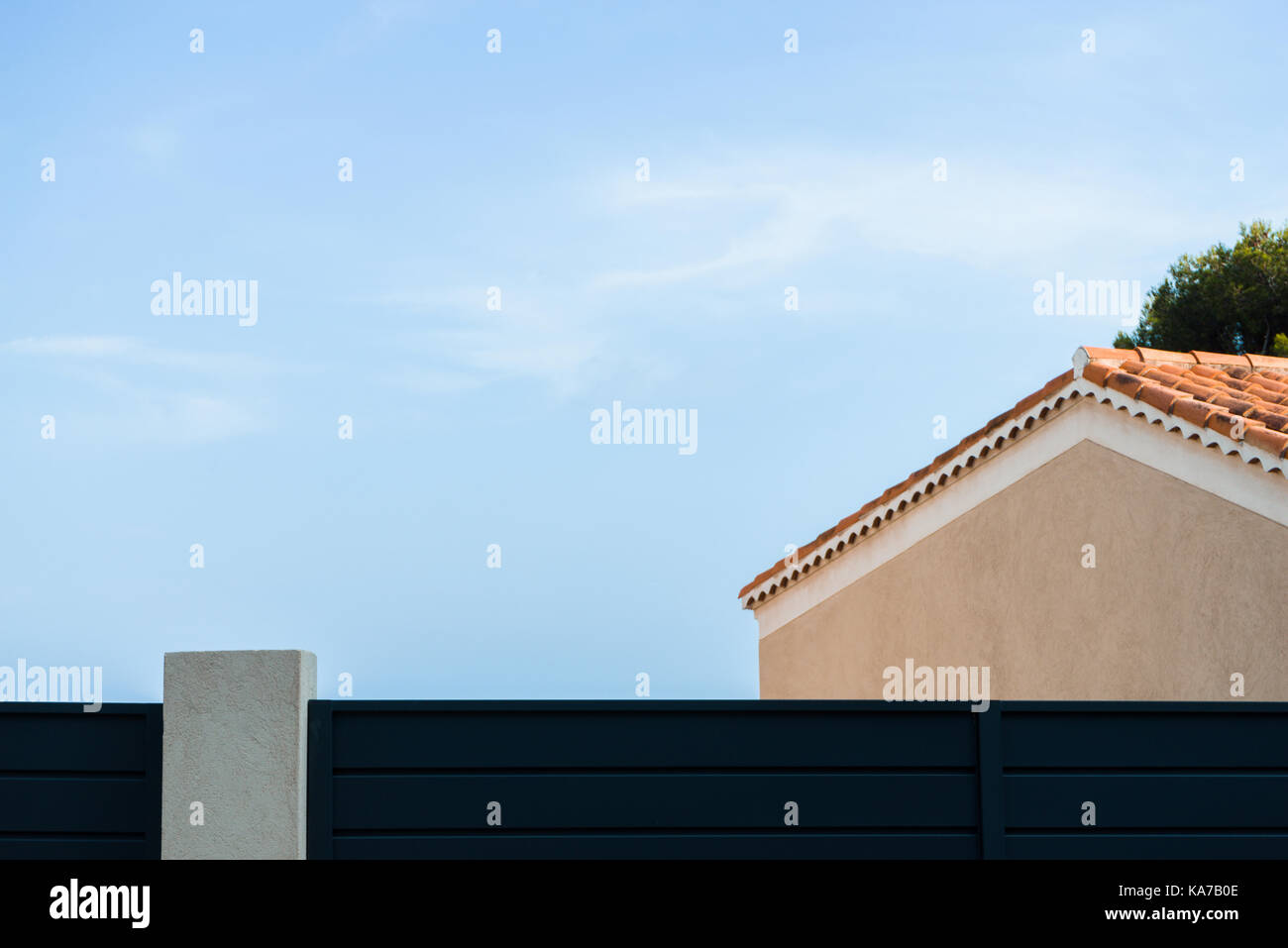 Roof of a yellow house against a blue sky background side view ...