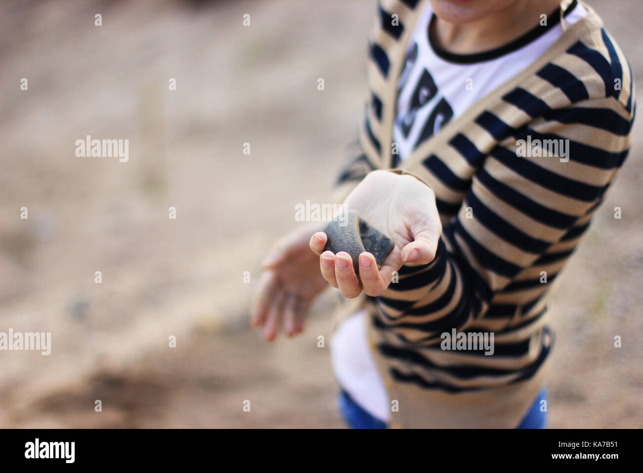 closeup of womans hands holding a stones Stock Photo - Alamy