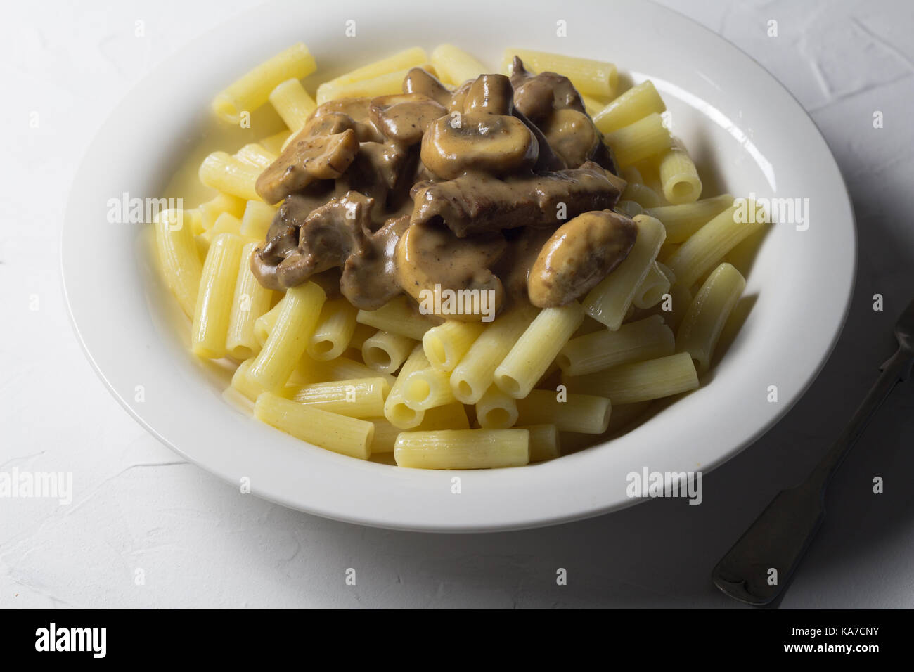 Beef Stroganoff on pasta close up - Russian food background Stock Photo ...