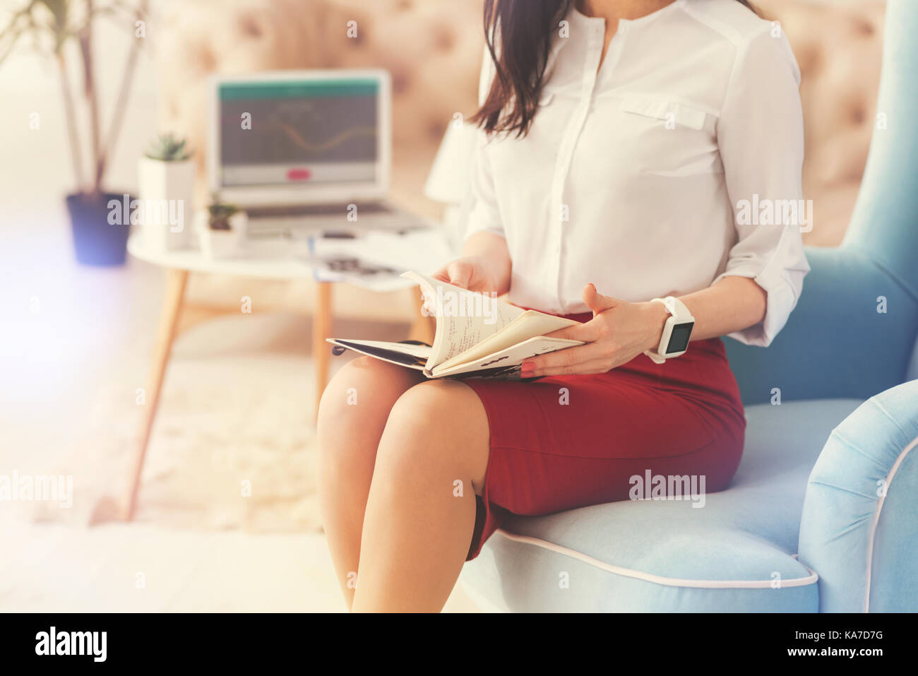 Young office worker looking for necessary number Stock Photo - Alamy