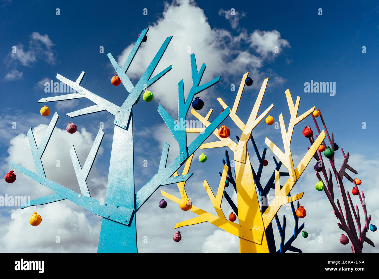 Abstract tree shapes against the sky with clouds close-up horizontal ...