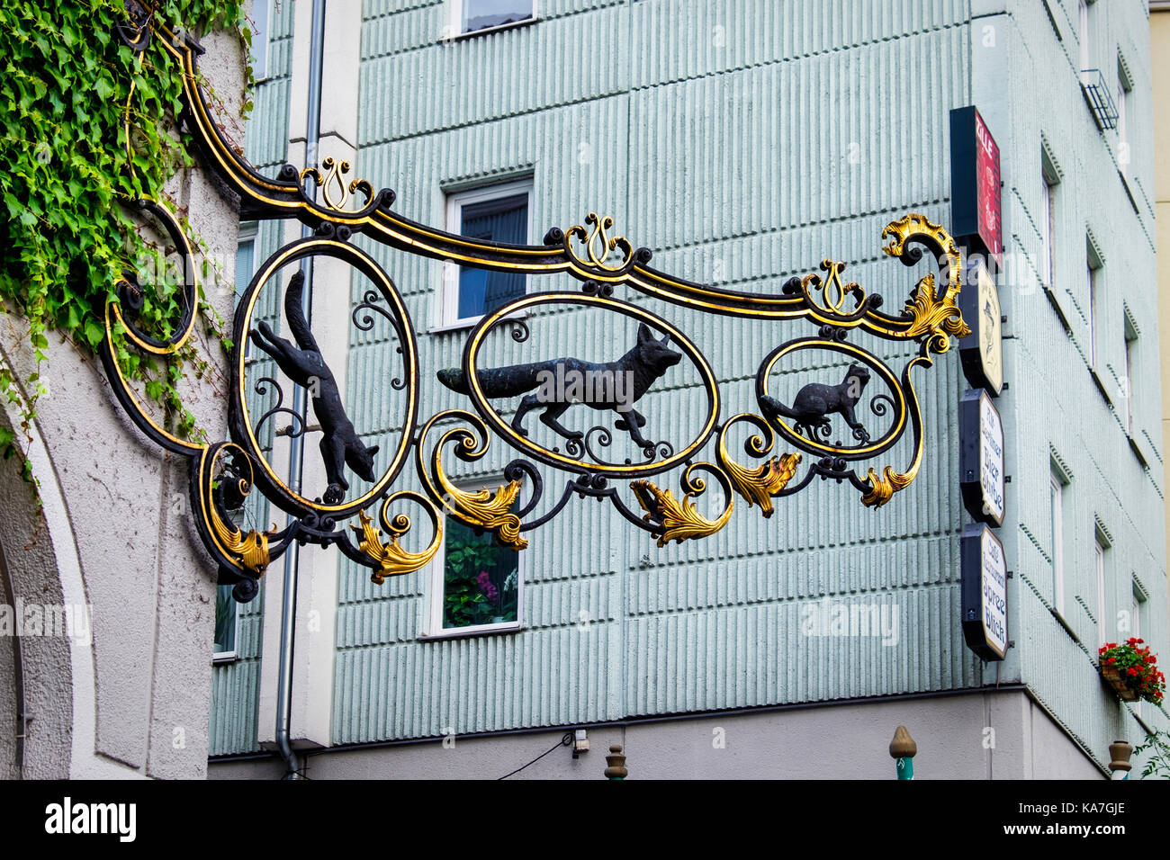 Decorative wrought iron sign outside Berlin shop. Wrought iron,black ...