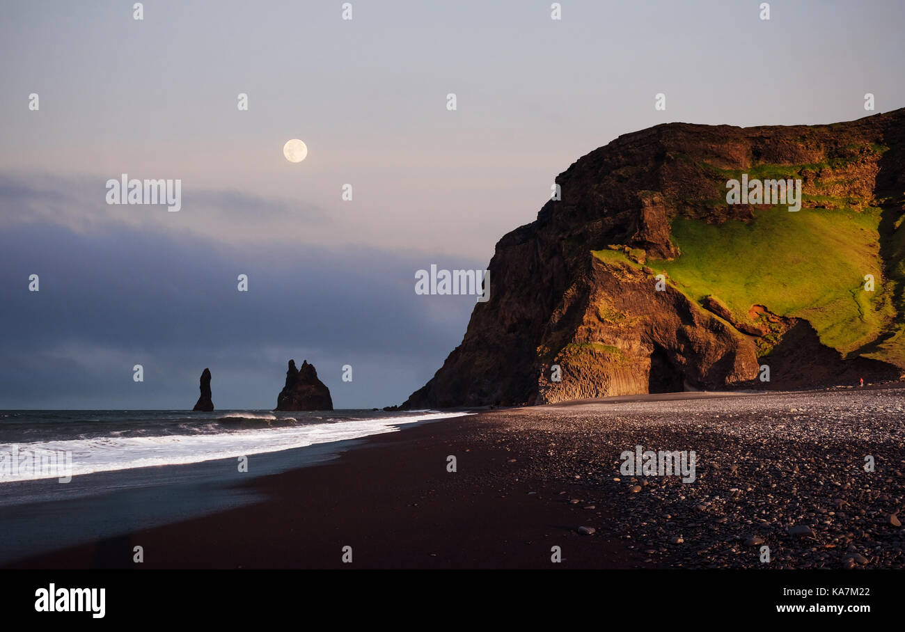 Famous Reynisdrangar rock formations at black Reynisfjara Beach. Coast ...
