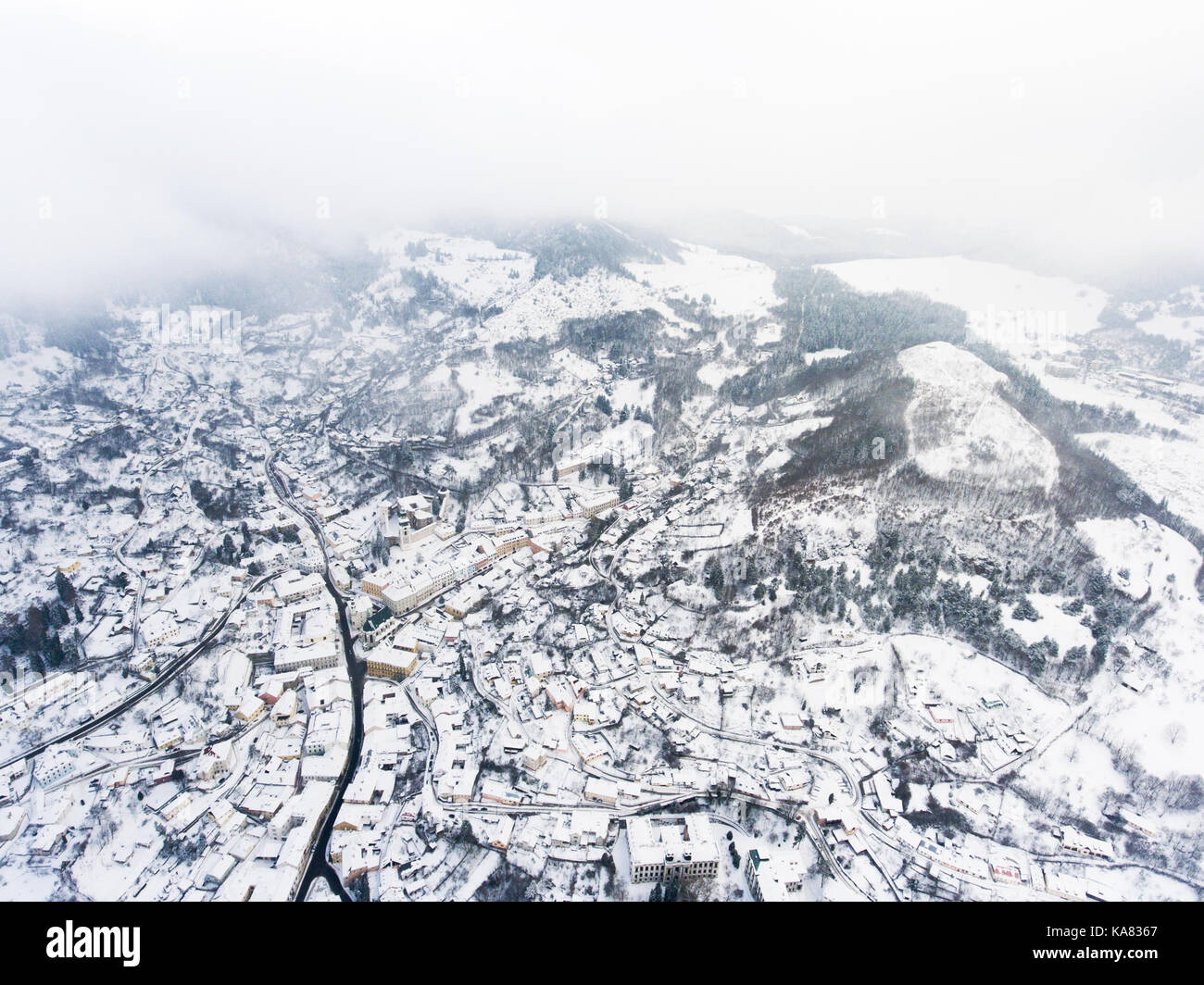 Aerial view of small town with hills in winter Stock Photo - Alamy