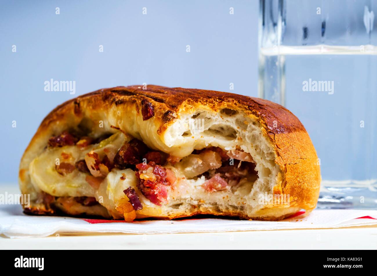 Bitten neapolitan sandwich with bacon pieces cheese Stock Photo - Alamy