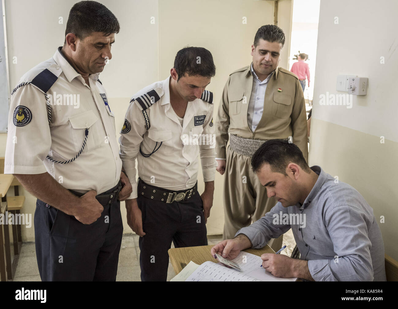 Kurdish policemen are casting their vote. 25th Sep, 2017. Credit: Berci ...