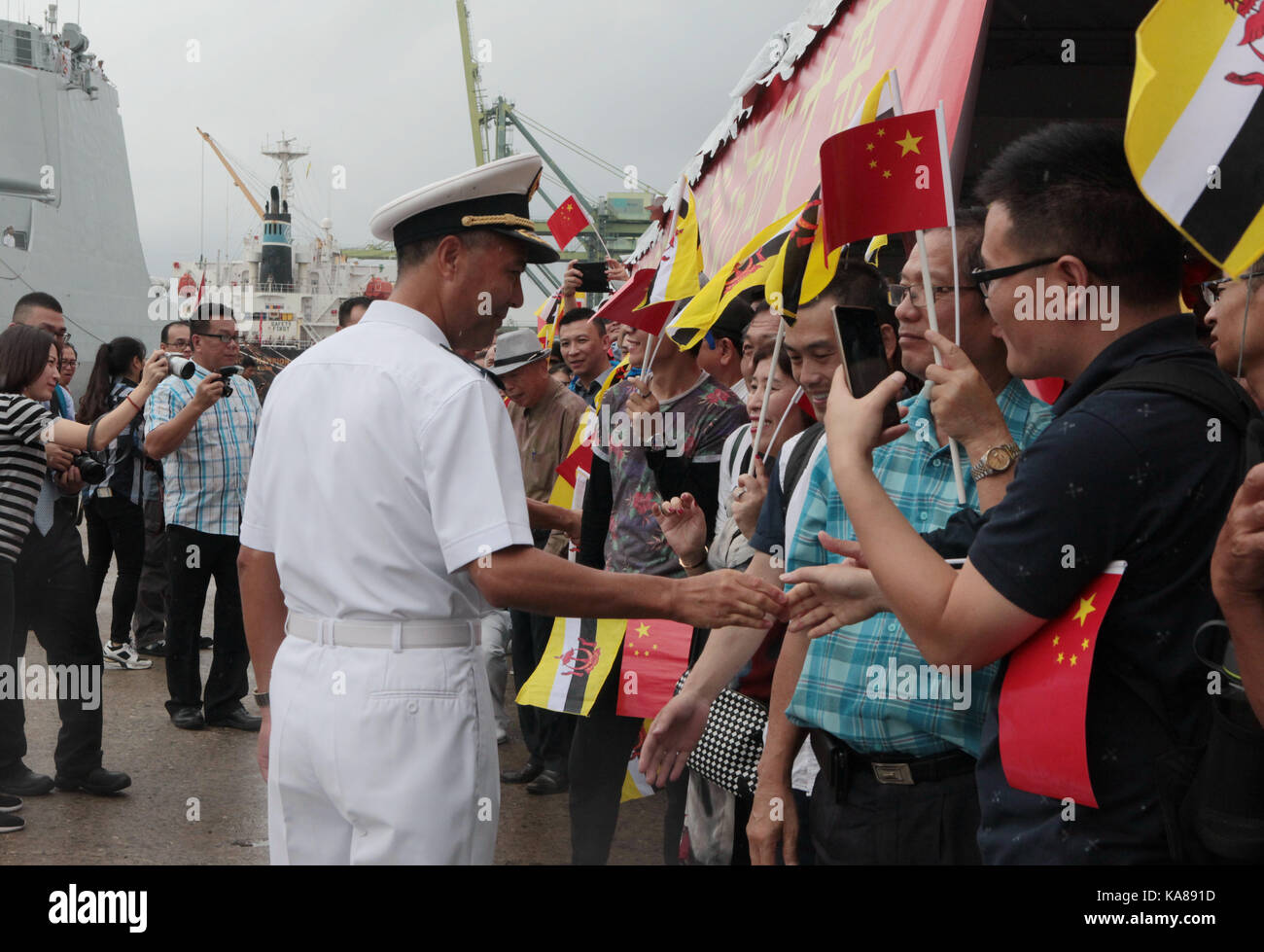 Muara Port, Brunei. 25th Sep, 2017. A Chinese naval officer shakes ...