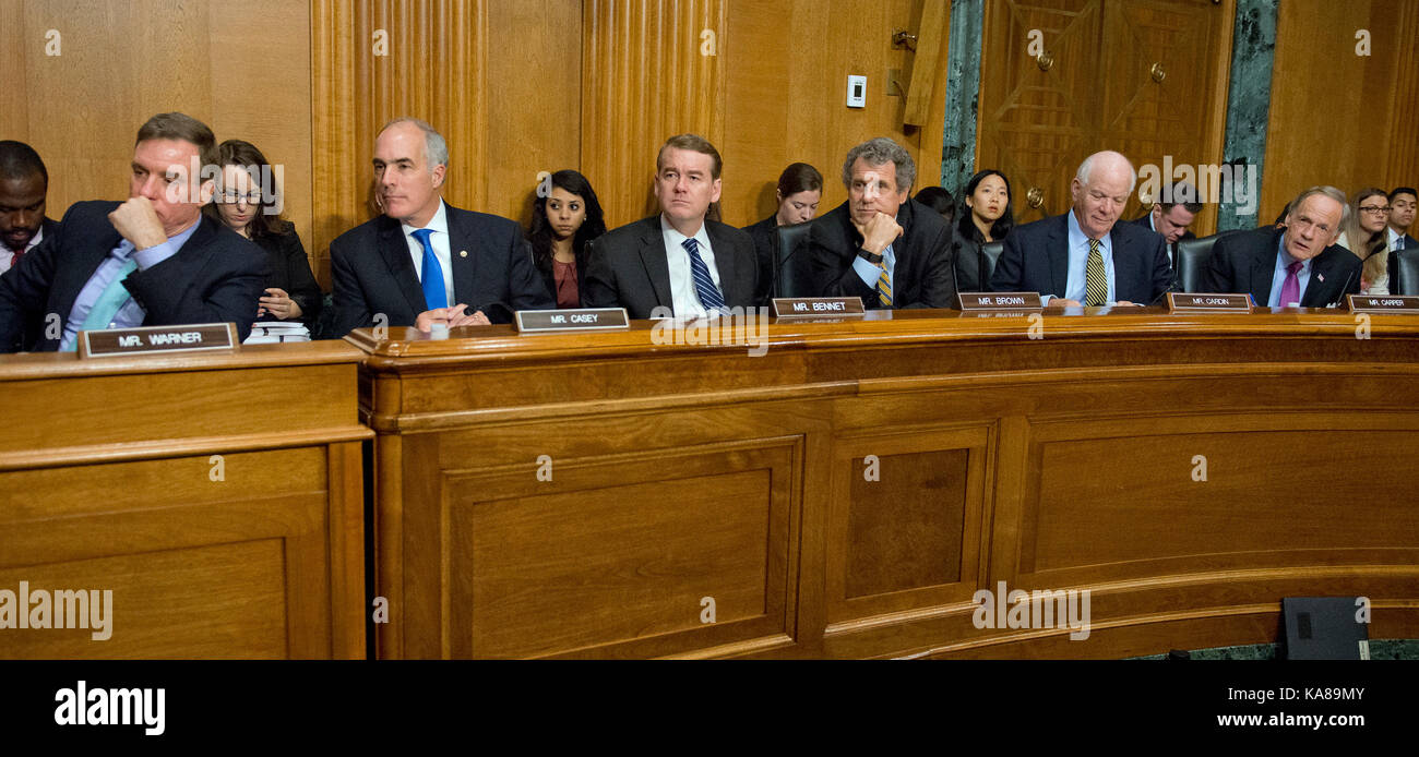 Democratic members of the US Senate Committee on Finance look on as US ...