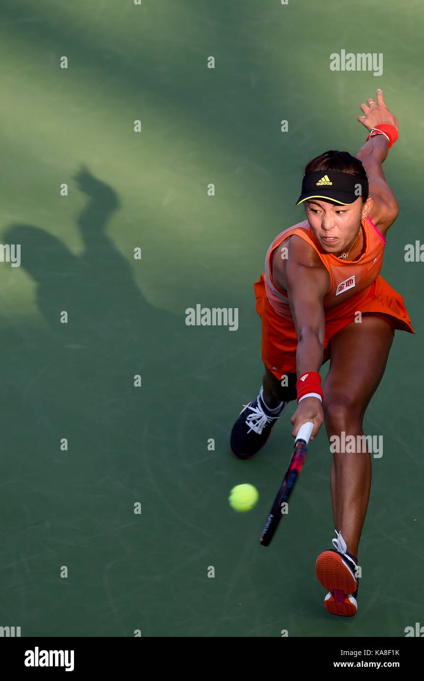 Wuhan, China. 26th Sep, 2017. Wang Qiang of China returns the ball ...