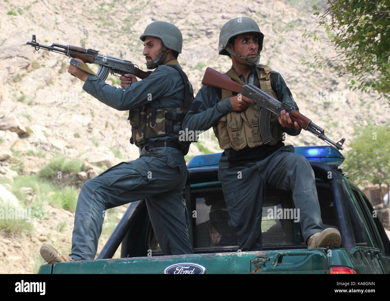 Asadabad, Afghanistan. 25th Sep, 2017. Afghan policemen stand guard on ...
