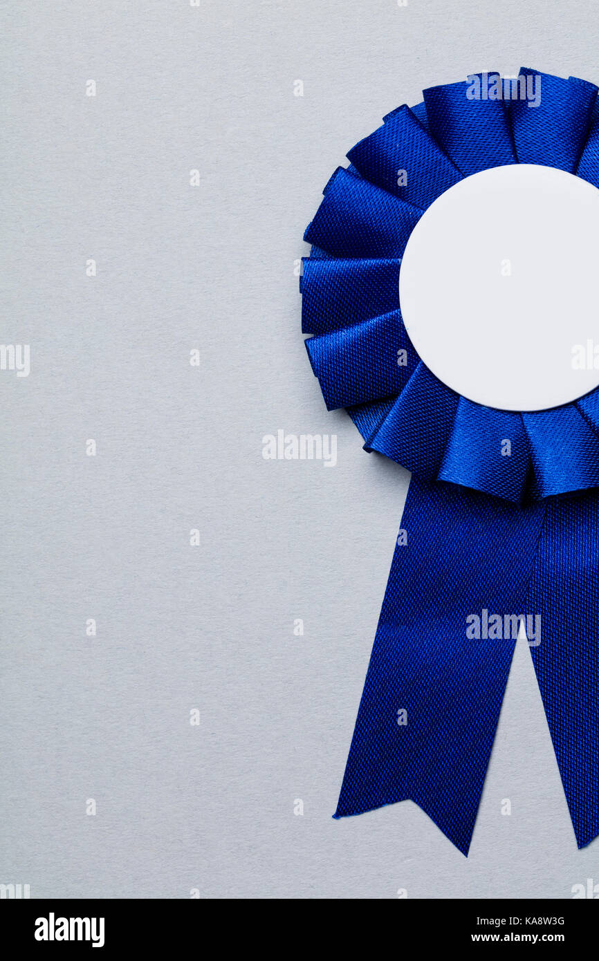 First place award rosette with blank white centre. Success achievement ...