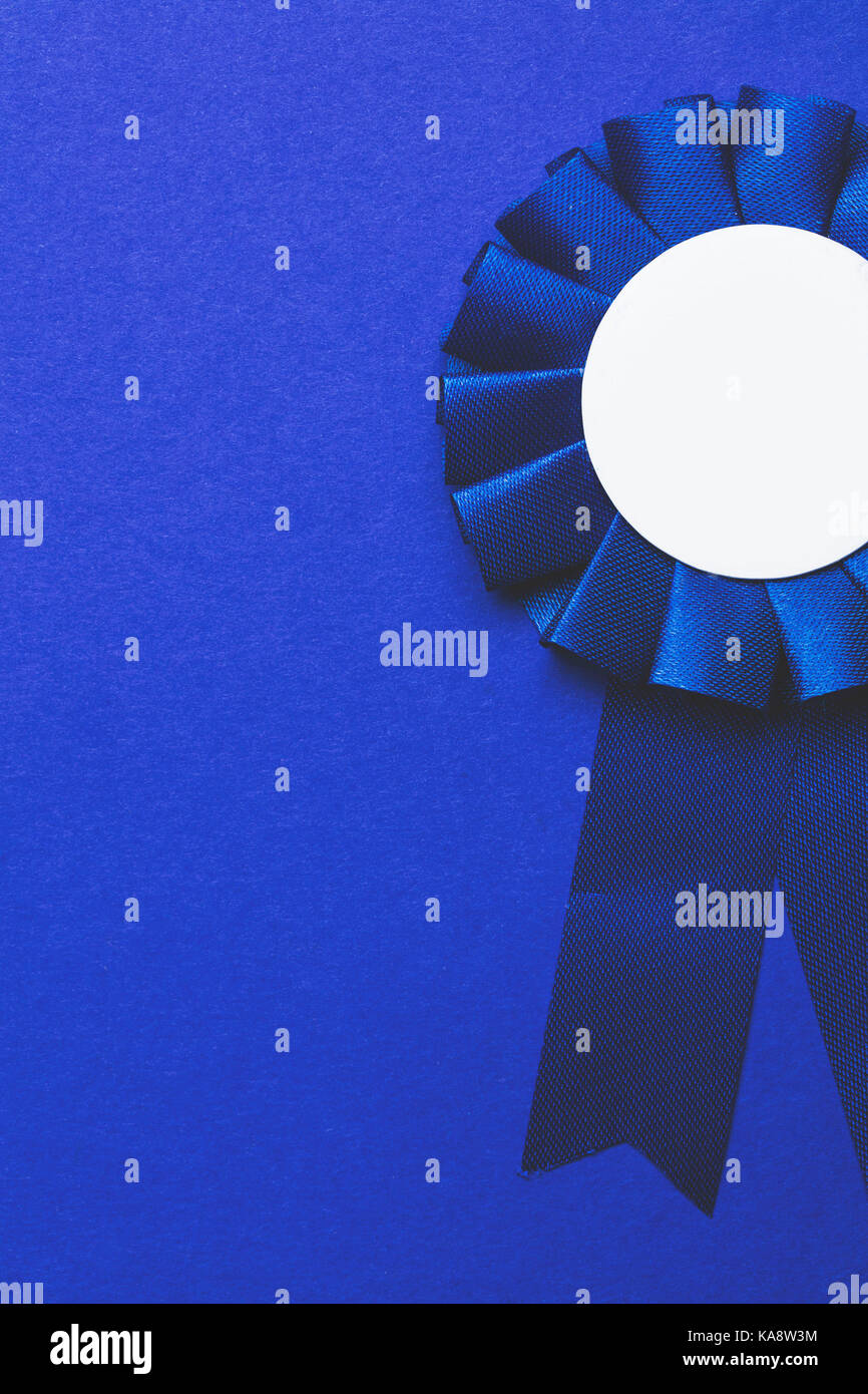 First place award rosette with blank white centre. Success achievement ...