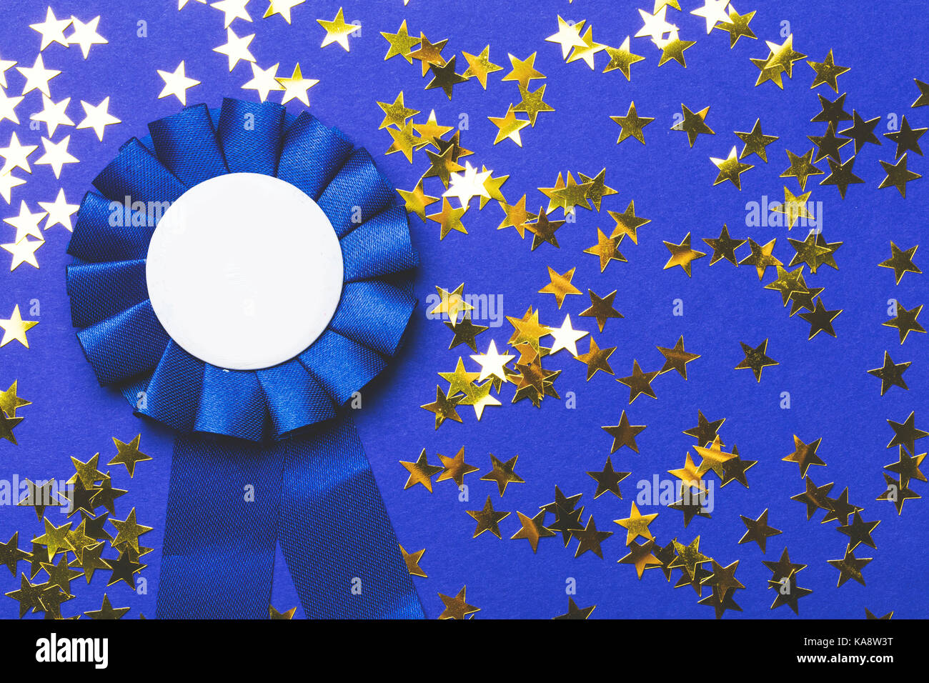 First place award rosette with gold stars. Success achievement concept ...