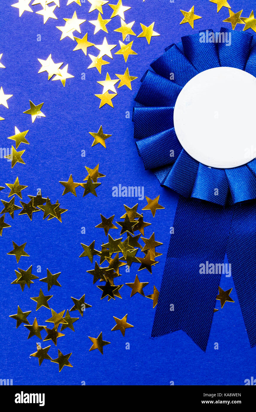 First place award rosette with gold stars. Success achievement concept ...