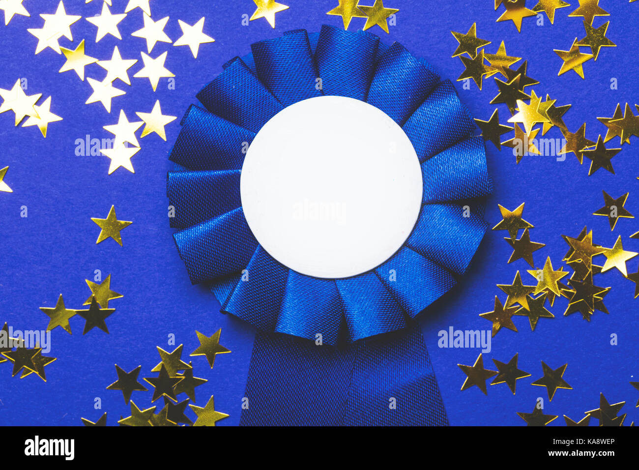 First place award rosette with gold stars. Success achievement concept ...