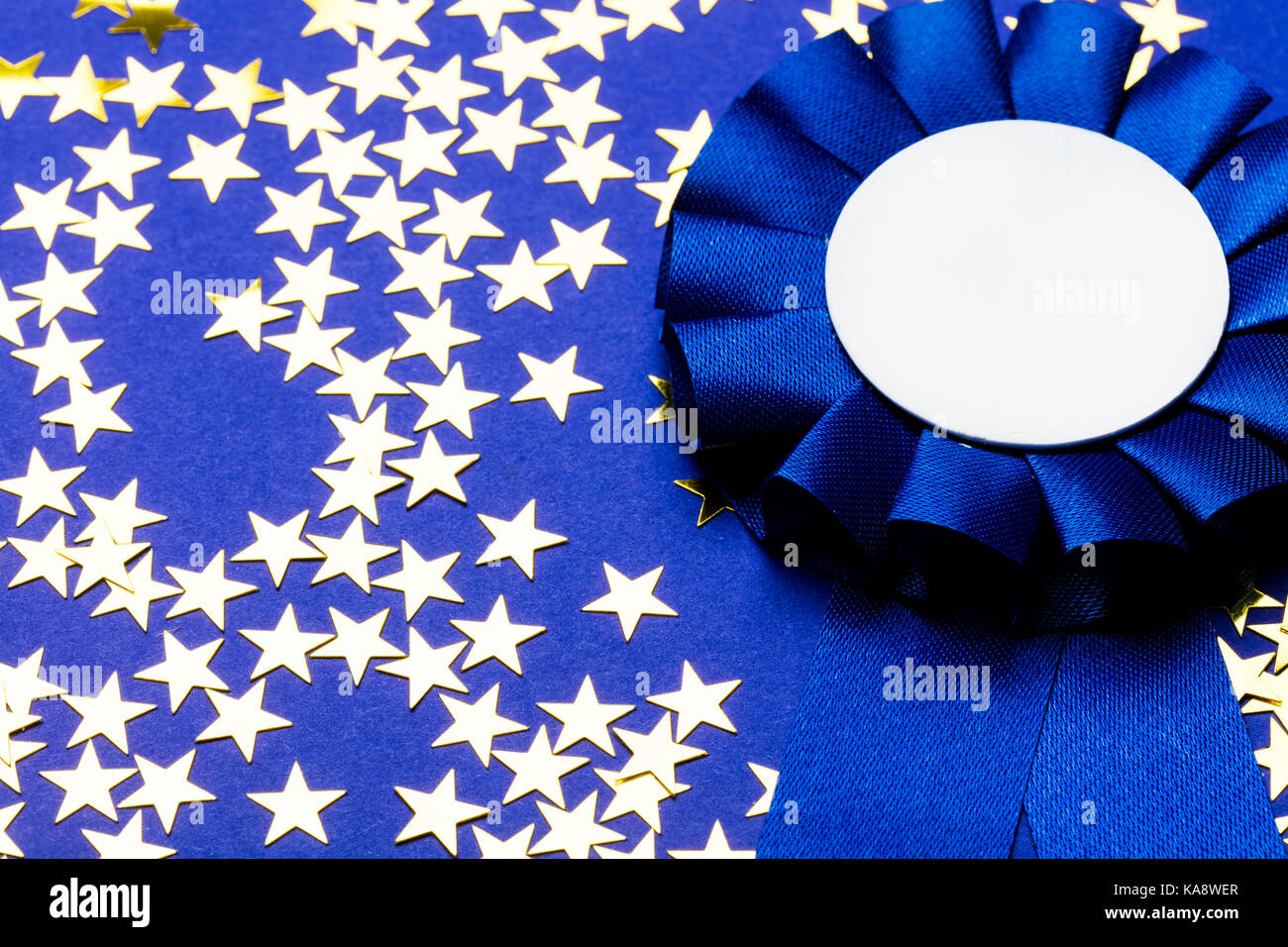 First place award rosette with gold stars. Success achievement concept ...