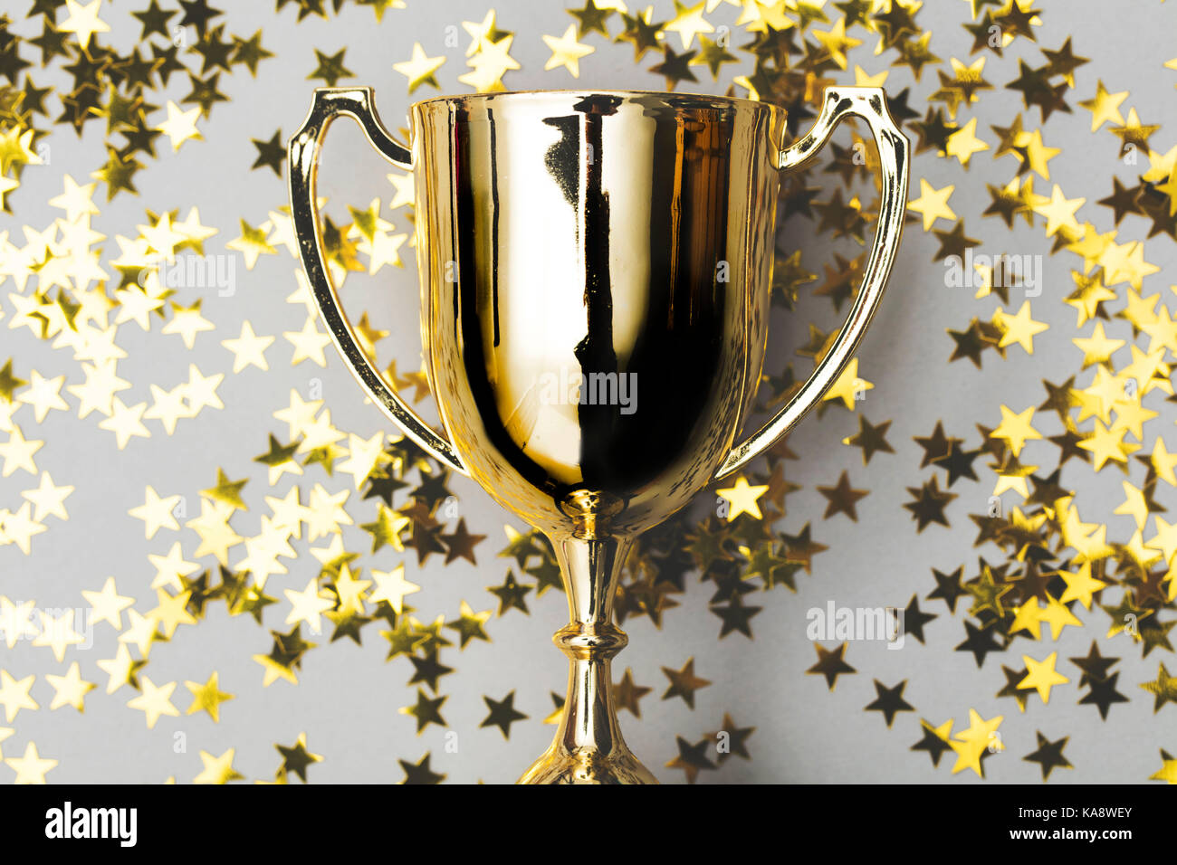 Gold winners trophy with golden shiny stars Stock Photo - Alamy
