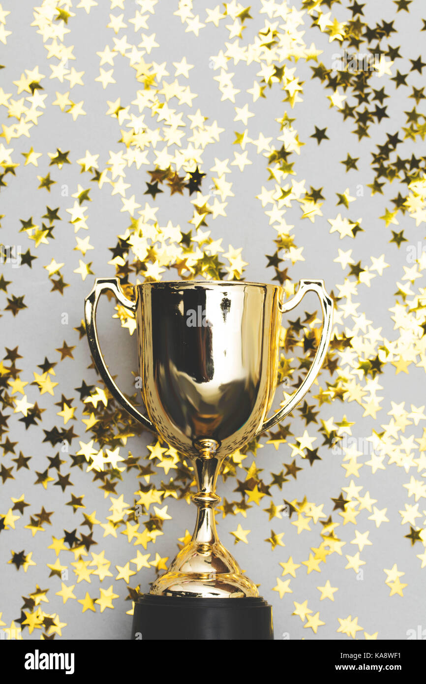 Gold winners trophy with golden shiny stars Stock Photo - Alamy