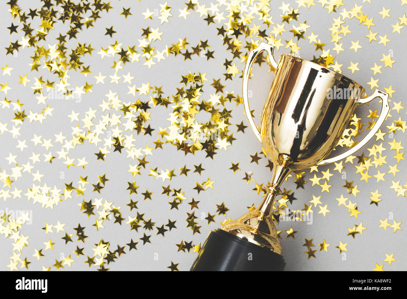 Gold winners trophy with golden shiny stars Stock Photo - Alamy