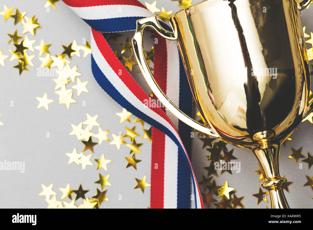 Gold winners trophy with golden shiny stars Stock Photo - Alamy