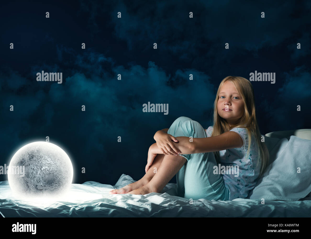 Girl in her bed and moon planet Stock Photo - Alamy