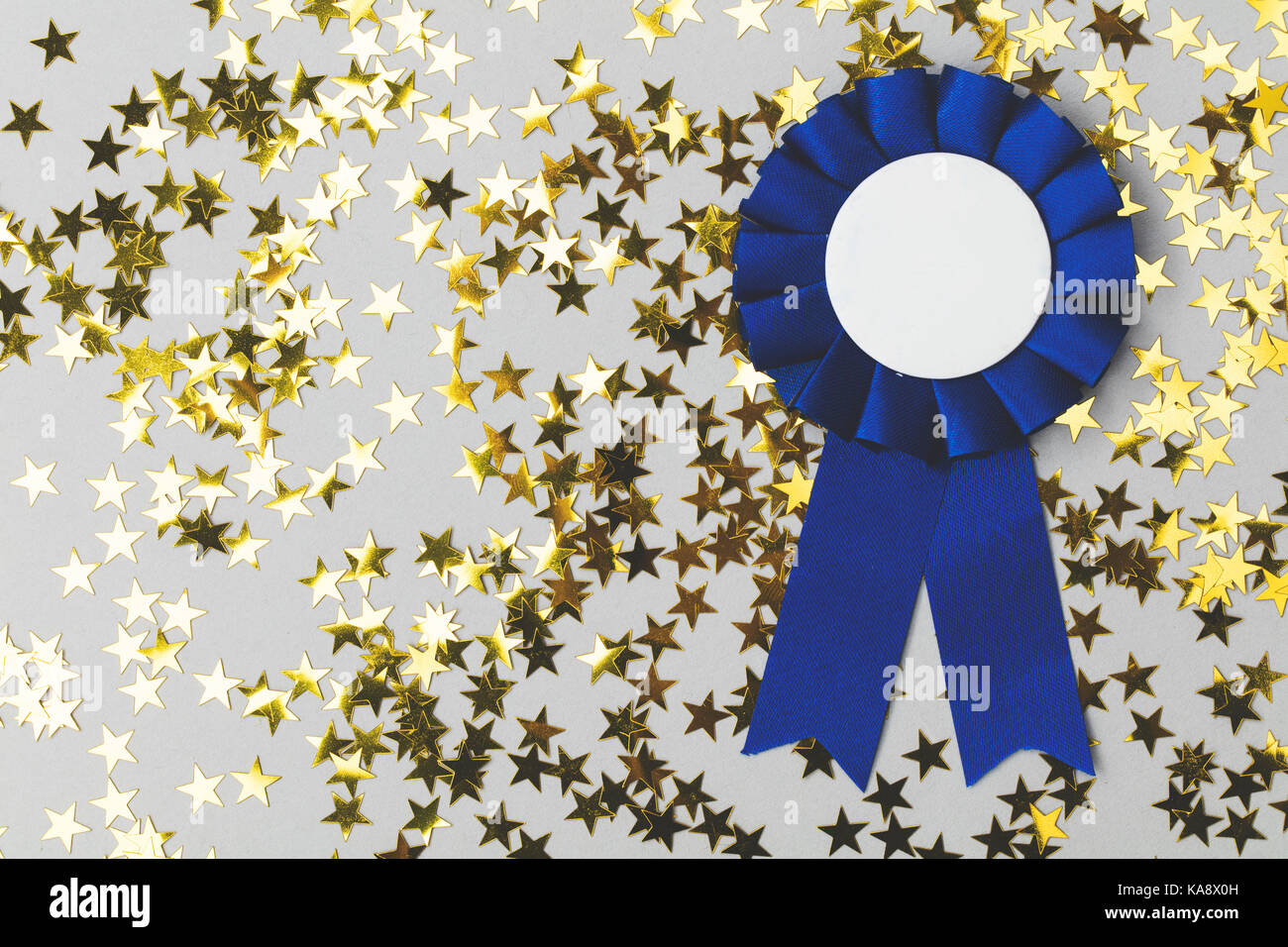 First place award rosette with gold stars. Success achievement concept ...